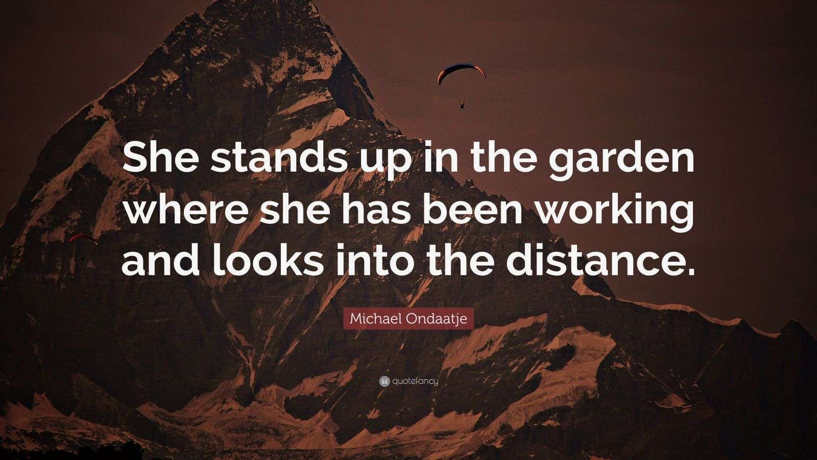 Michael Ondaatje Quote: “She stands up in the garden where she has been ...