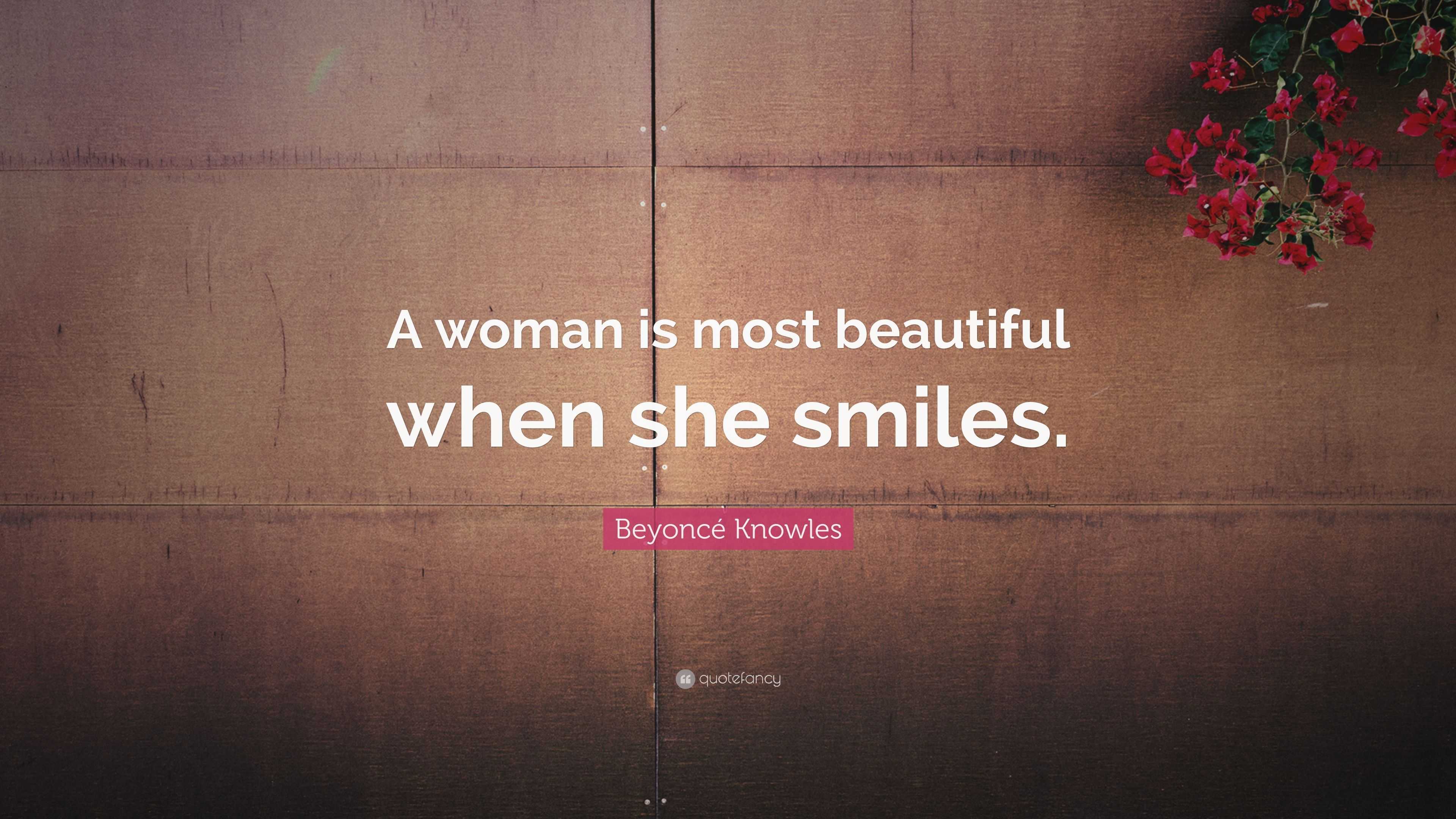 Beyoncé Knowles Quote: “A woman is most beautiful when she smiles.”