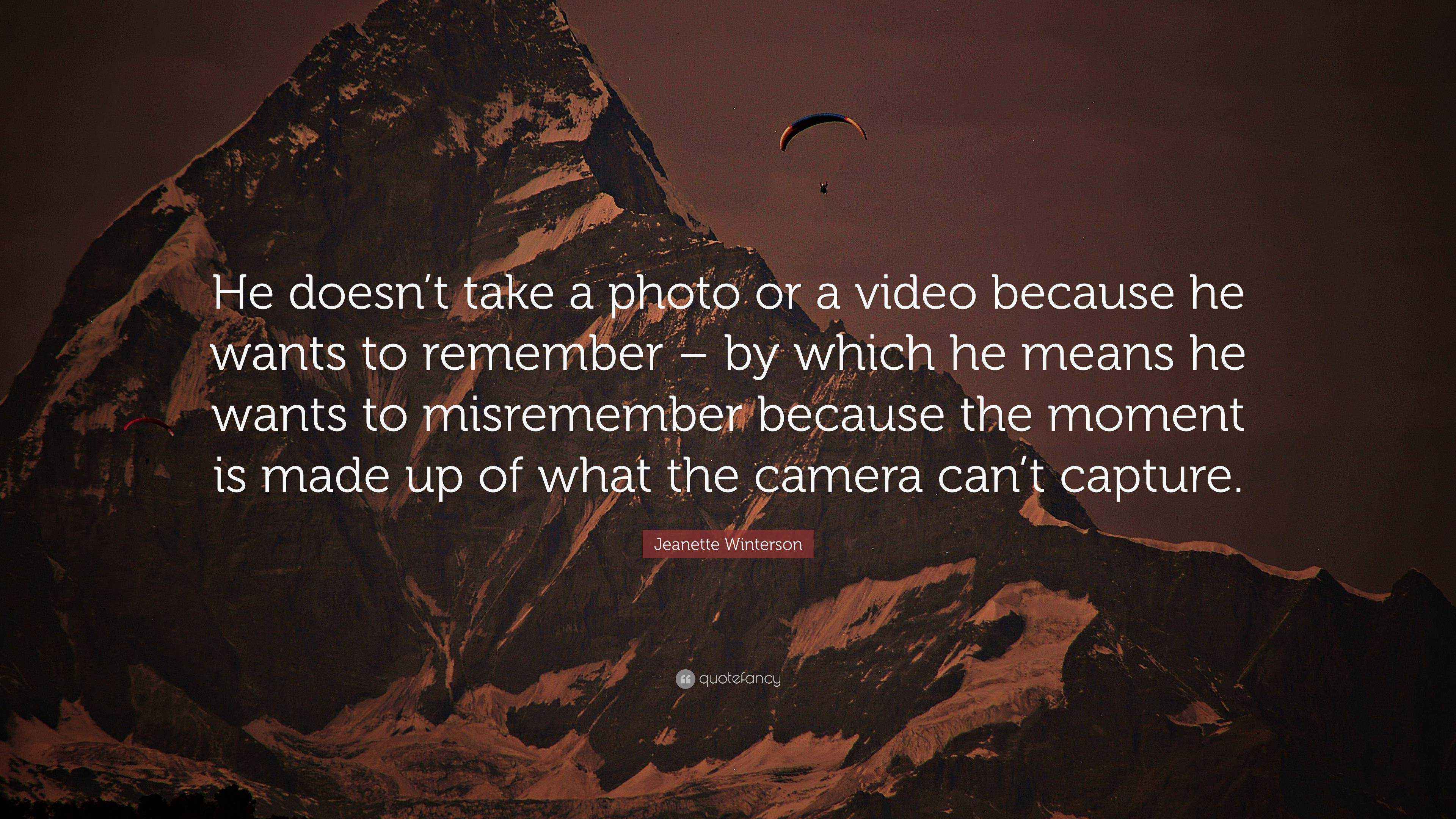 Jeanette Winterson Quote: “He doesn’t take a photo or a video because ...