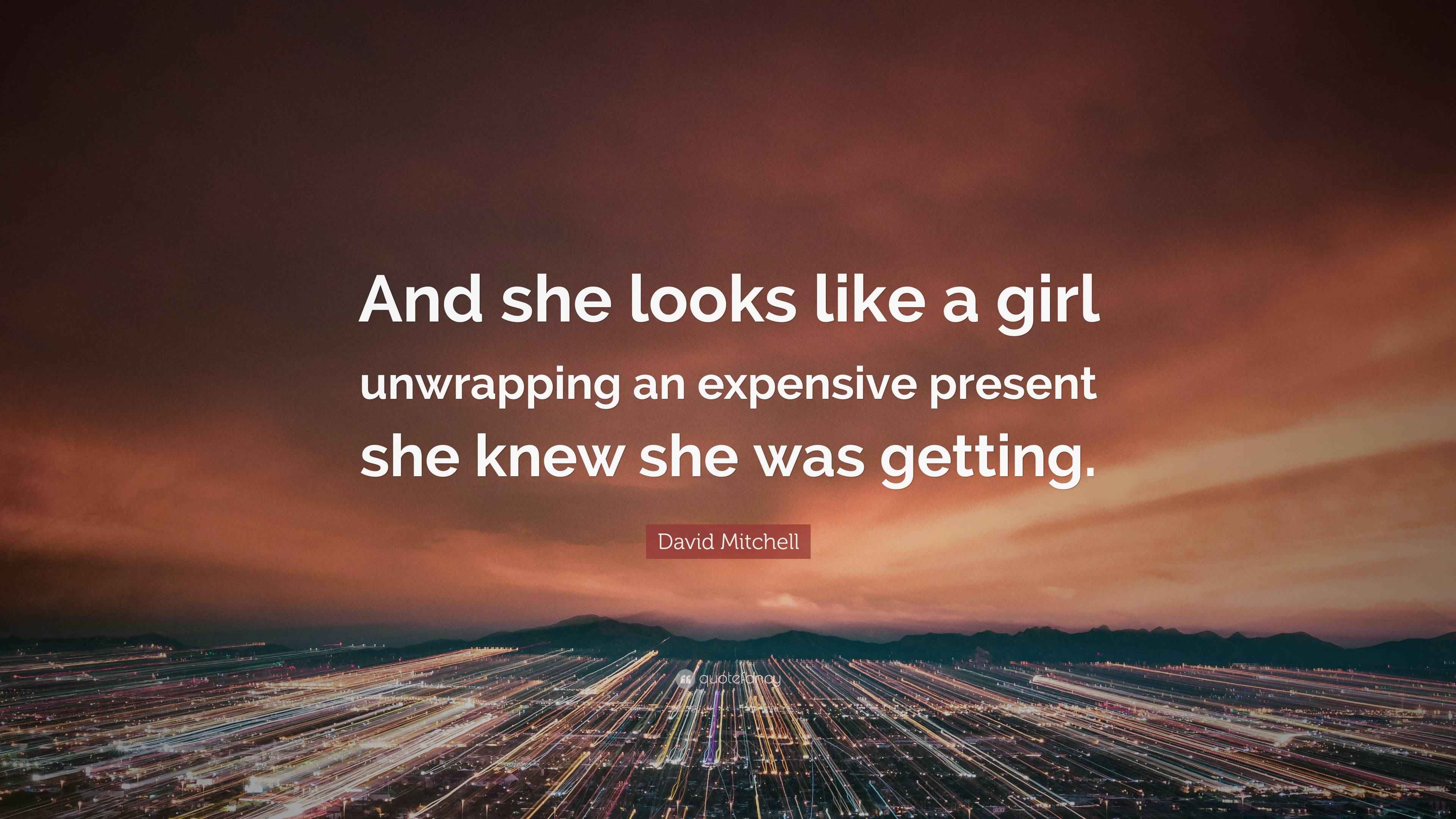 David Mitchell Quote: “And she looks like a girl unwrapping an ...