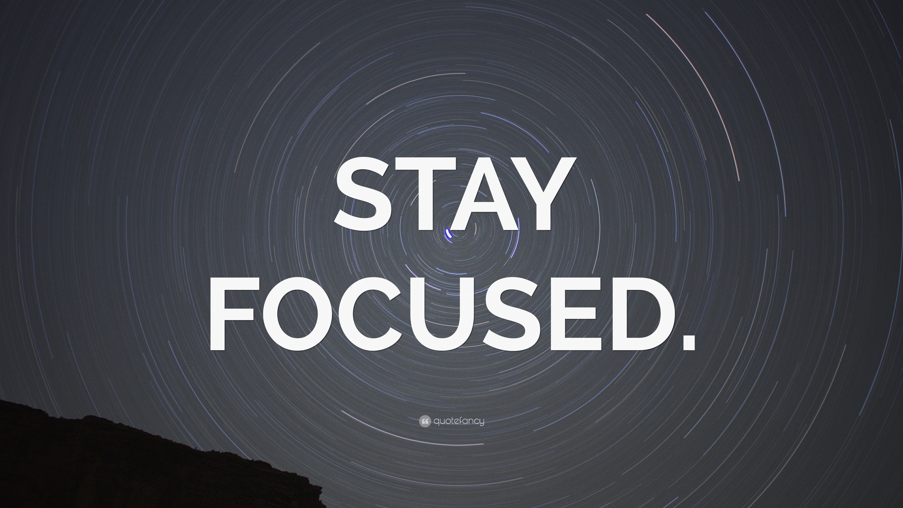 “STAY FOCUSED.” Wallpaper by QuoteFancy