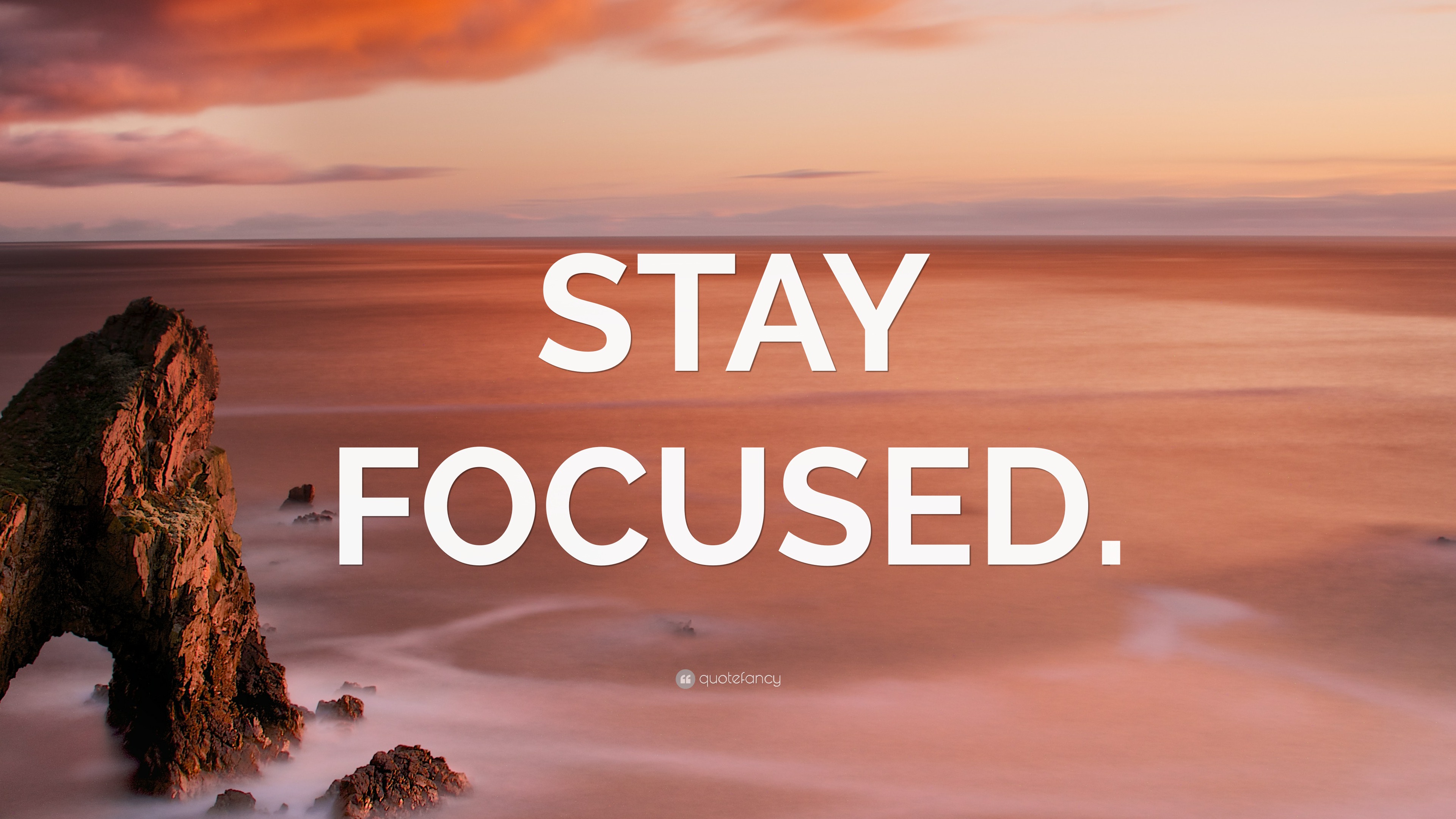 “STAY FOCUSED.” Wallpaper by QuoteFancy