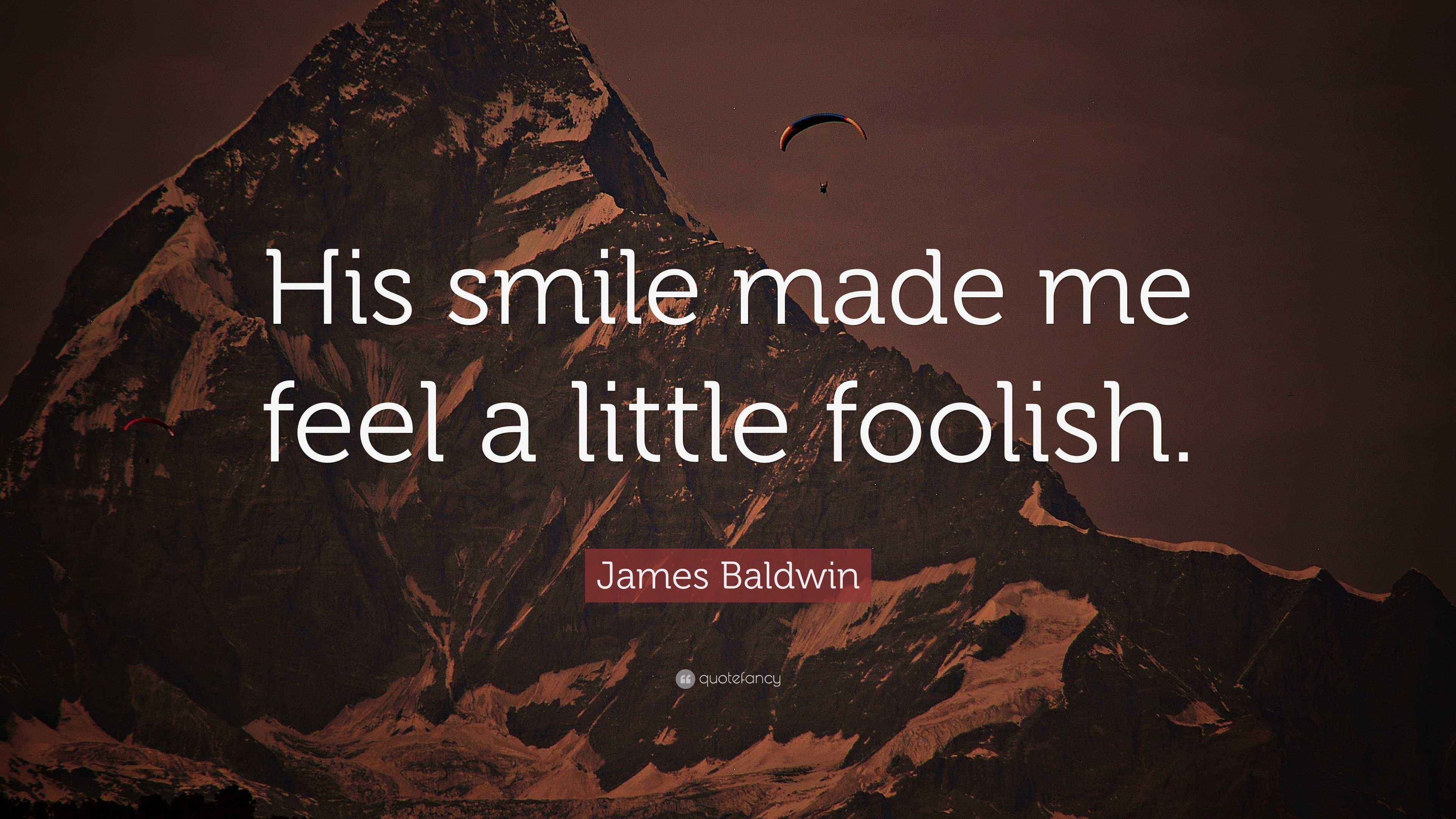 James Baldwin Quote: “His smile made me feel a little foolish.”