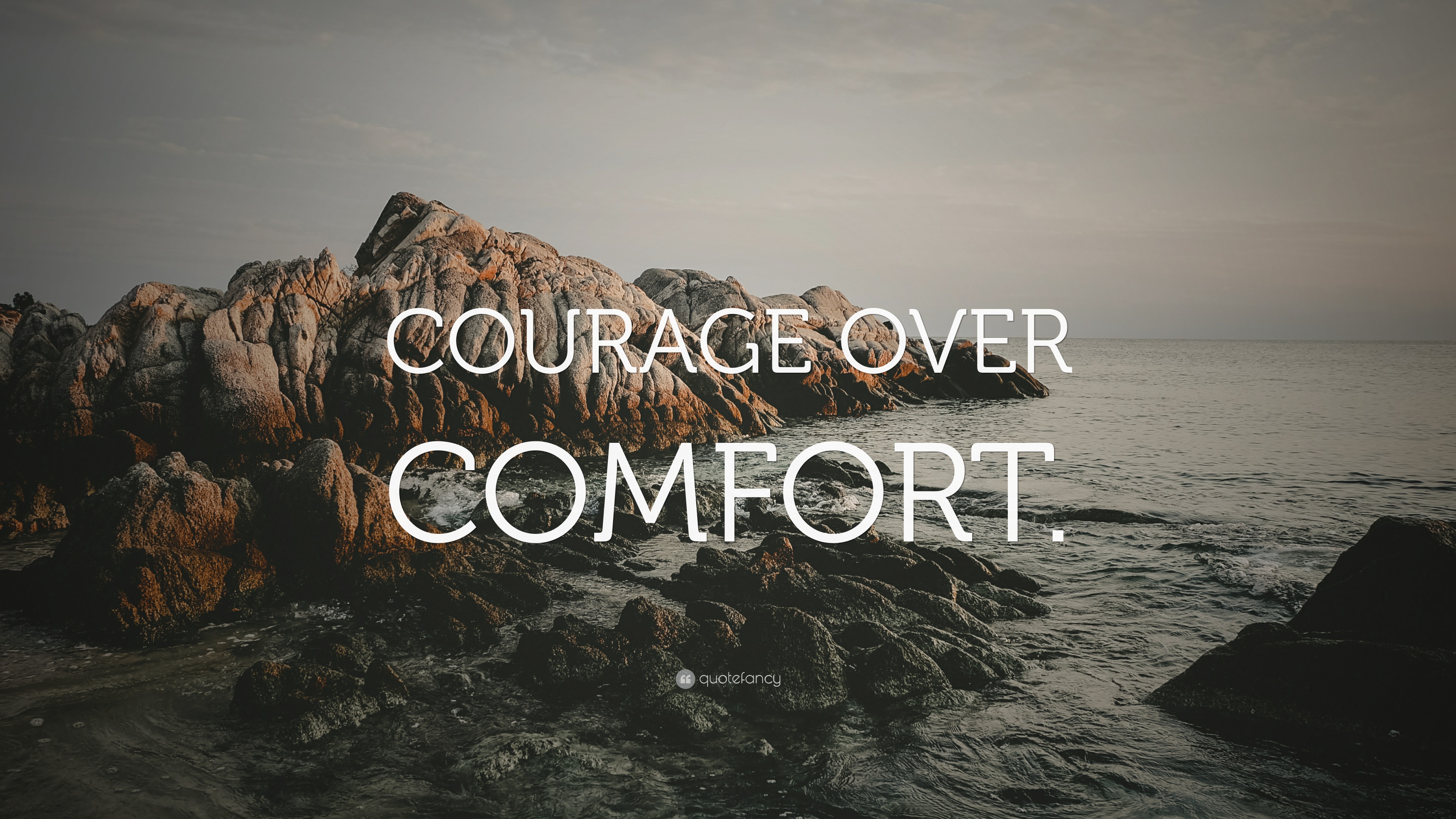“COURAGE OVER COMFORT.” Wallpaper by QuoteFancy
