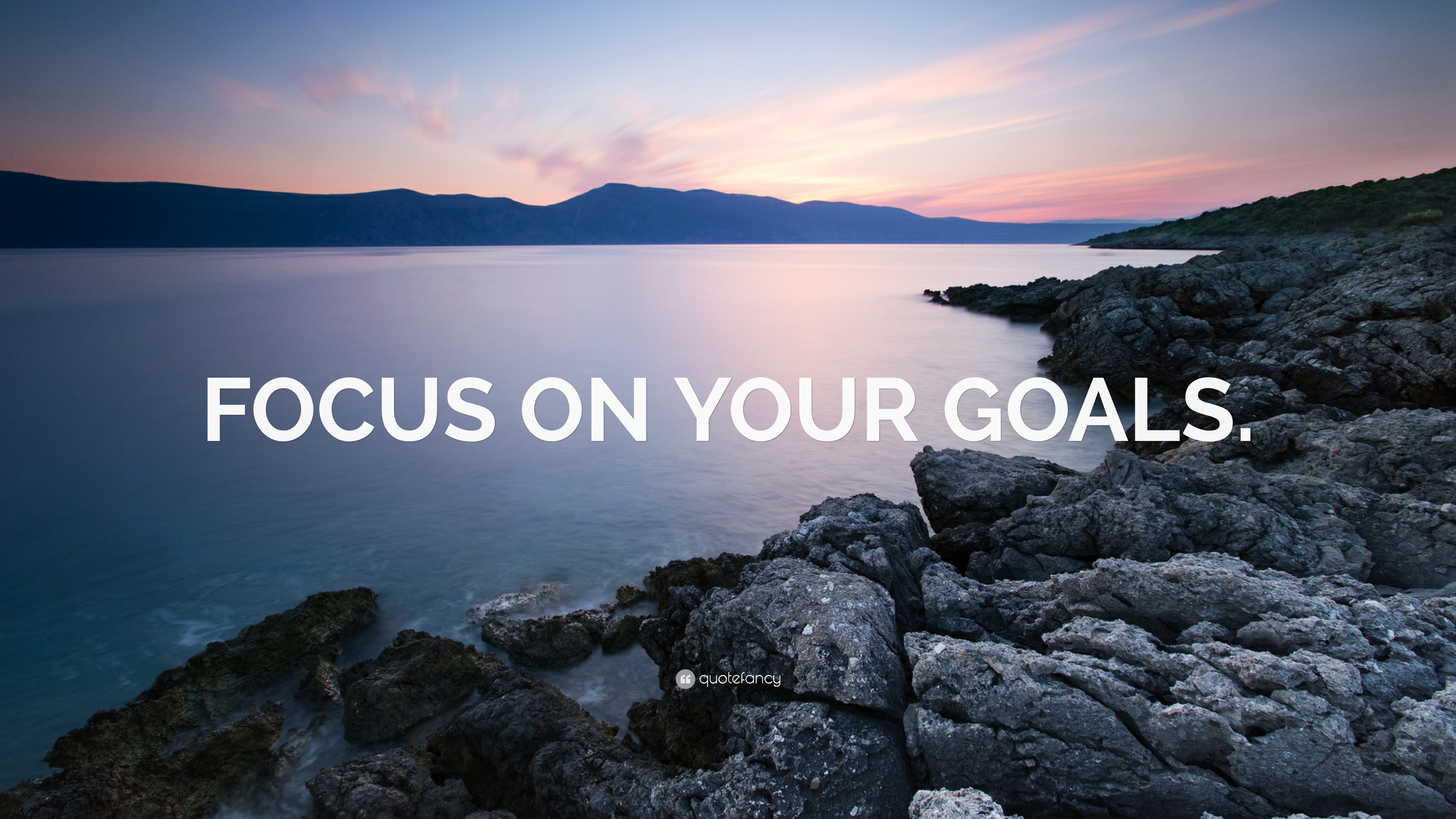 “FOCUS ON YOUR GOALS.” Wallpaper by QuoteFancy