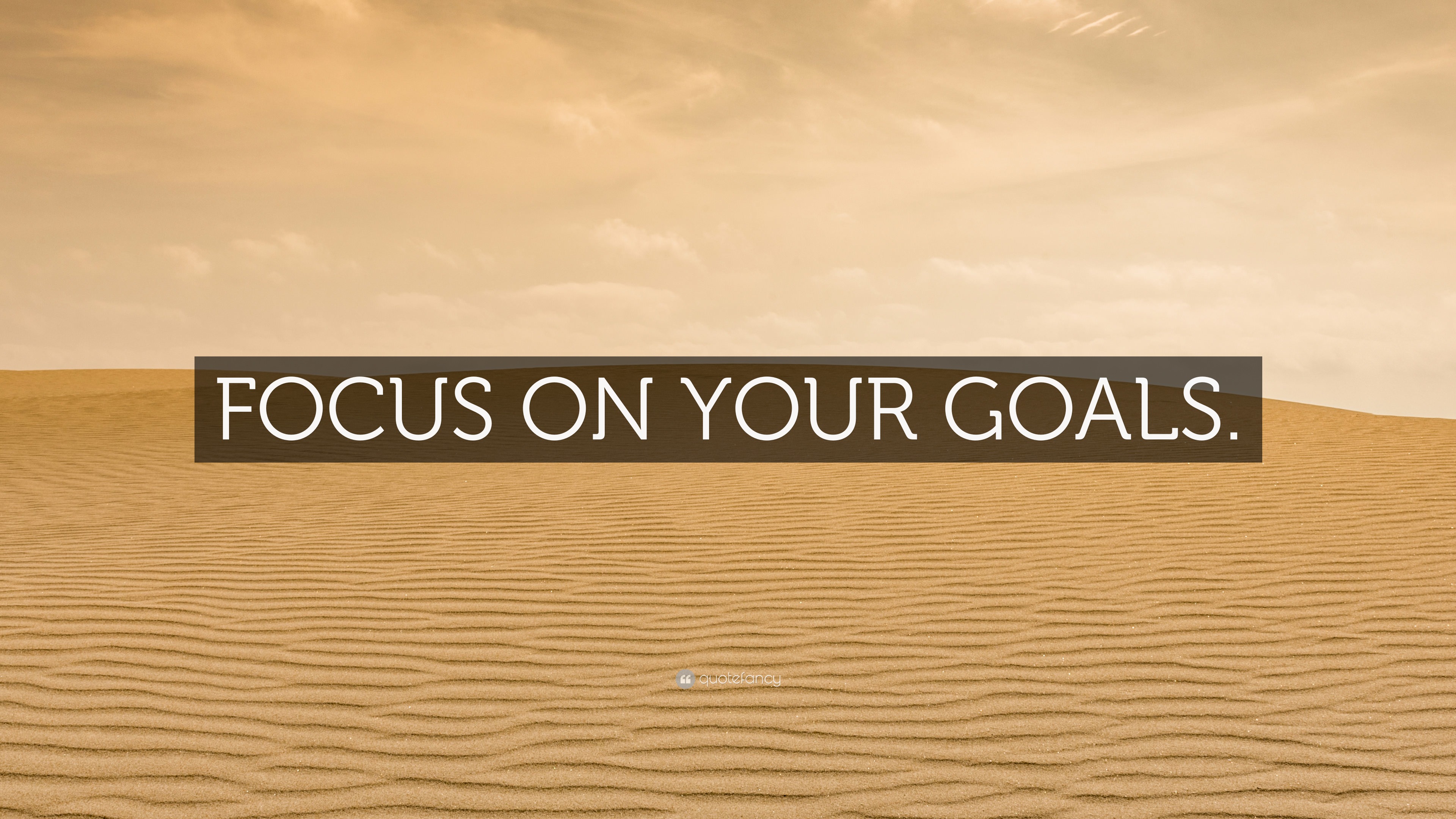 “FOCUS ON YOUR GOALS.” Wallpaper by QuoteFancy