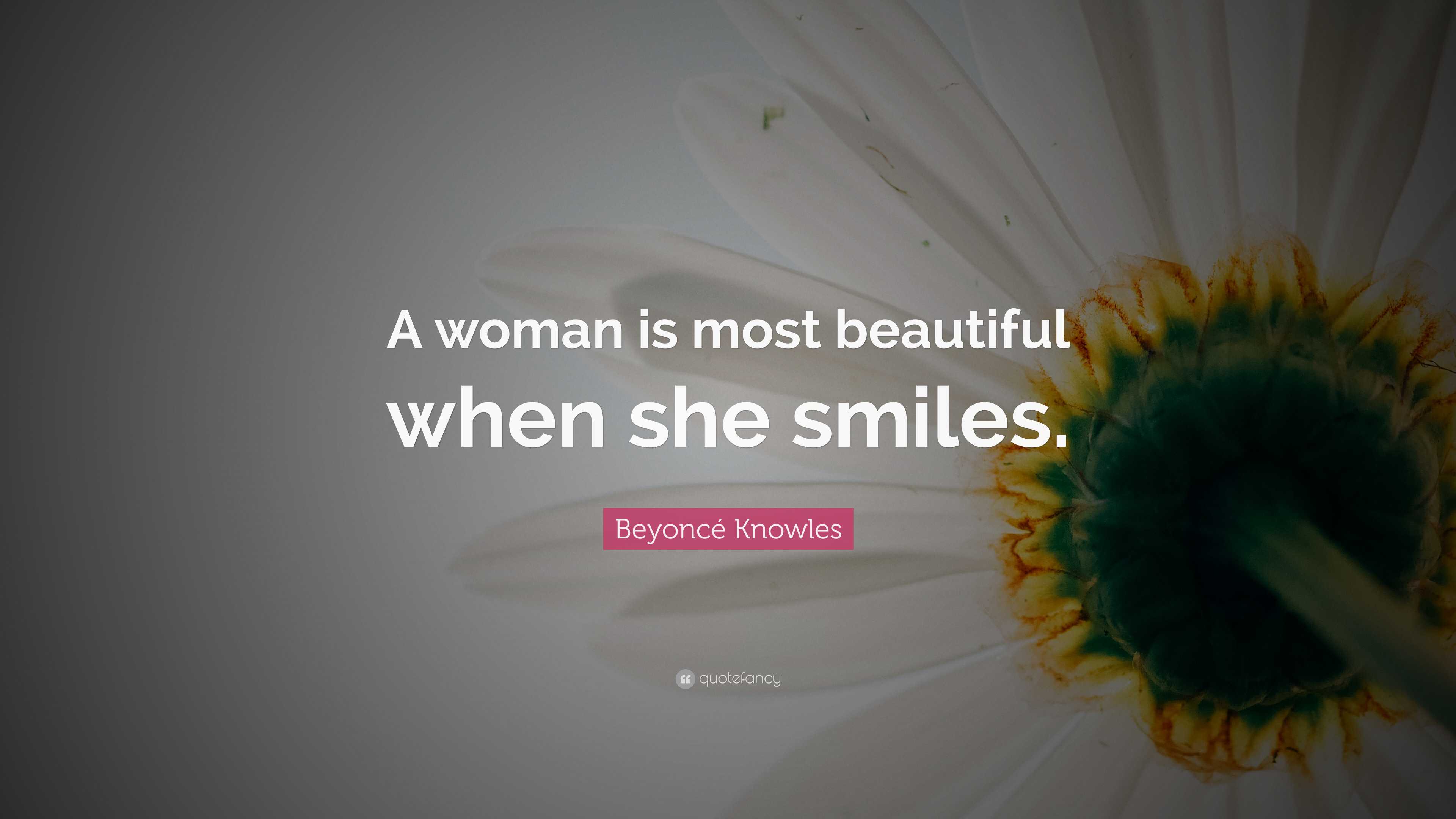 Beyoncé Knowles Quote: “A woman is most beautiful when she smiles.”