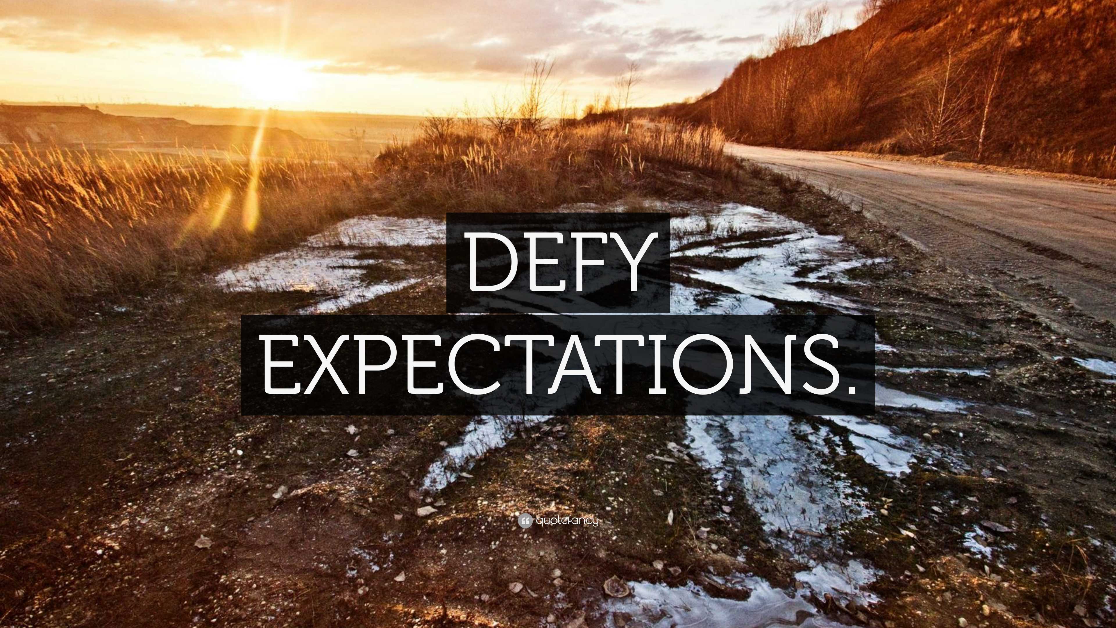 “DEFY EXPECTATIONS.” Wallpaper by QuoteFancy